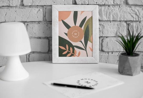 Desk With Frame And Plant Psd - Mockup Hunt