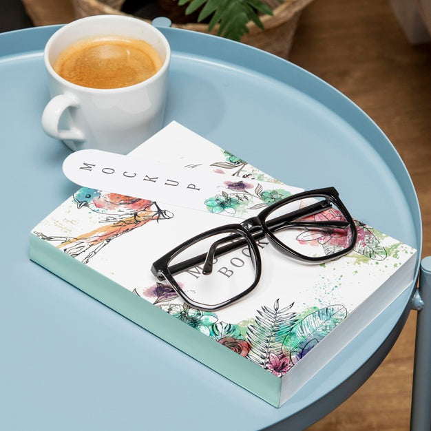 High Angle Book Mock-Up On Coffee Table With Glasses And Bookmark Psd ...