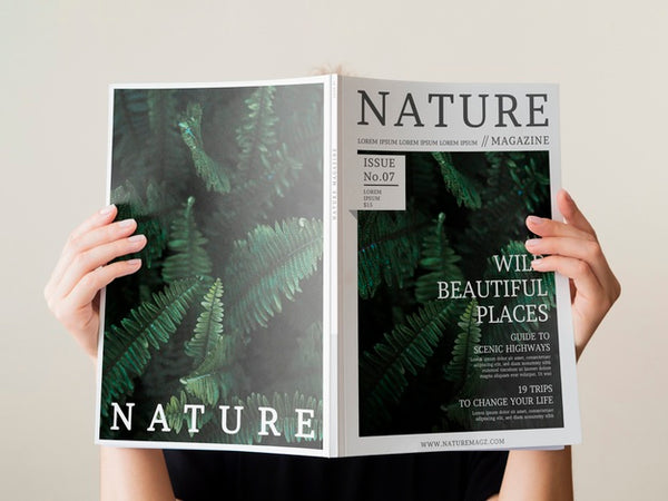 Womans Hand Holding A Nature Magazine Mock Up Psd - Mockup Hunt